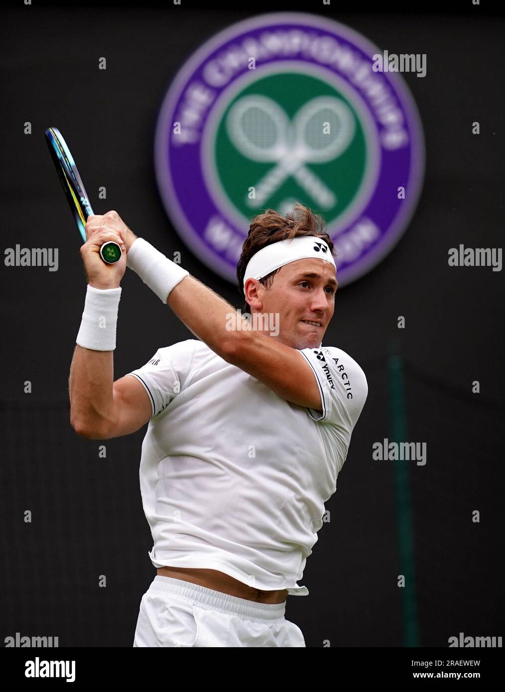 Casper Ruud in action against Laurent Lokoli (not pictured) on day one ...