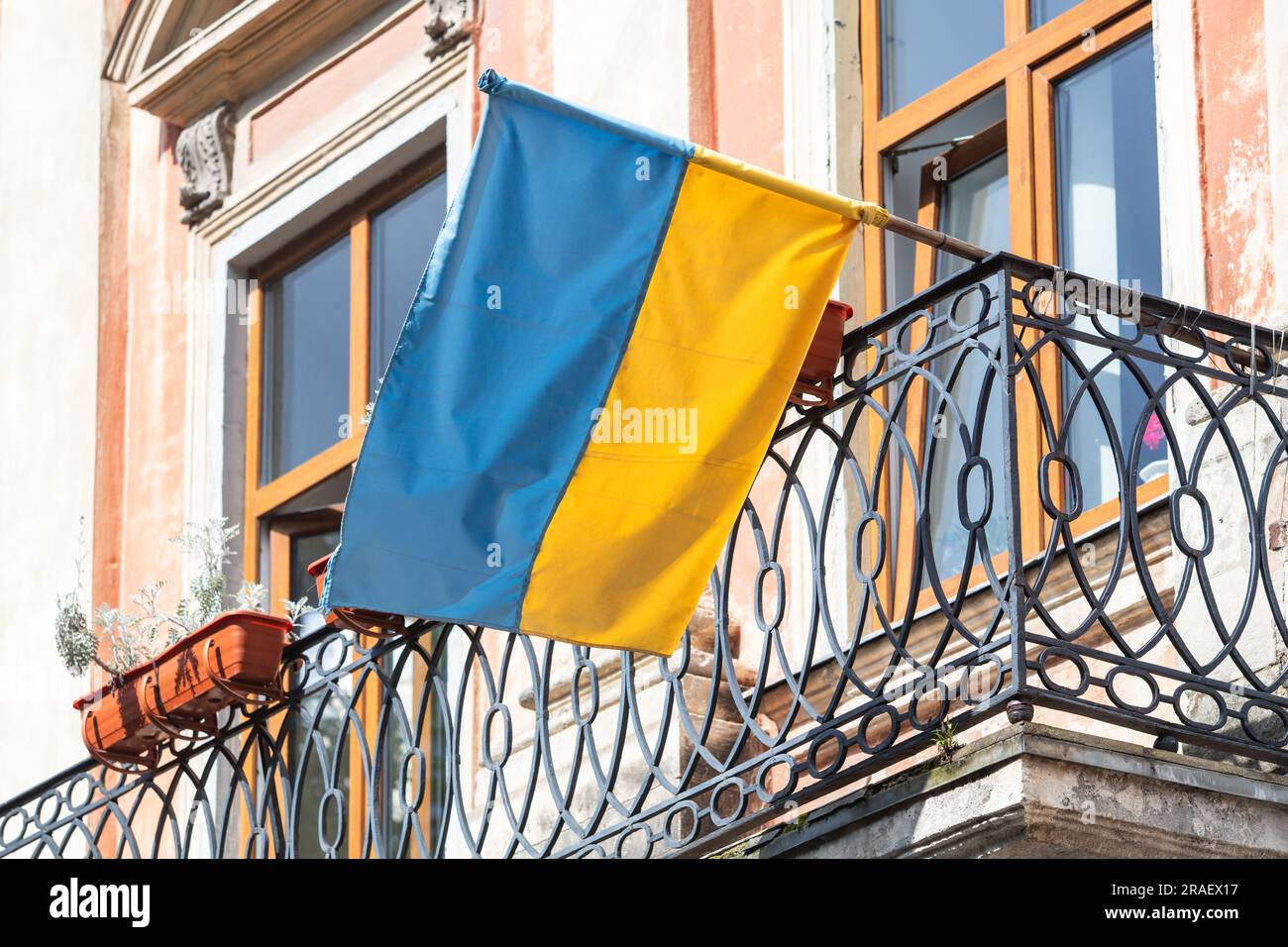 Ukrainian National Flag hanging on balcony in Lviv city center Stock ...