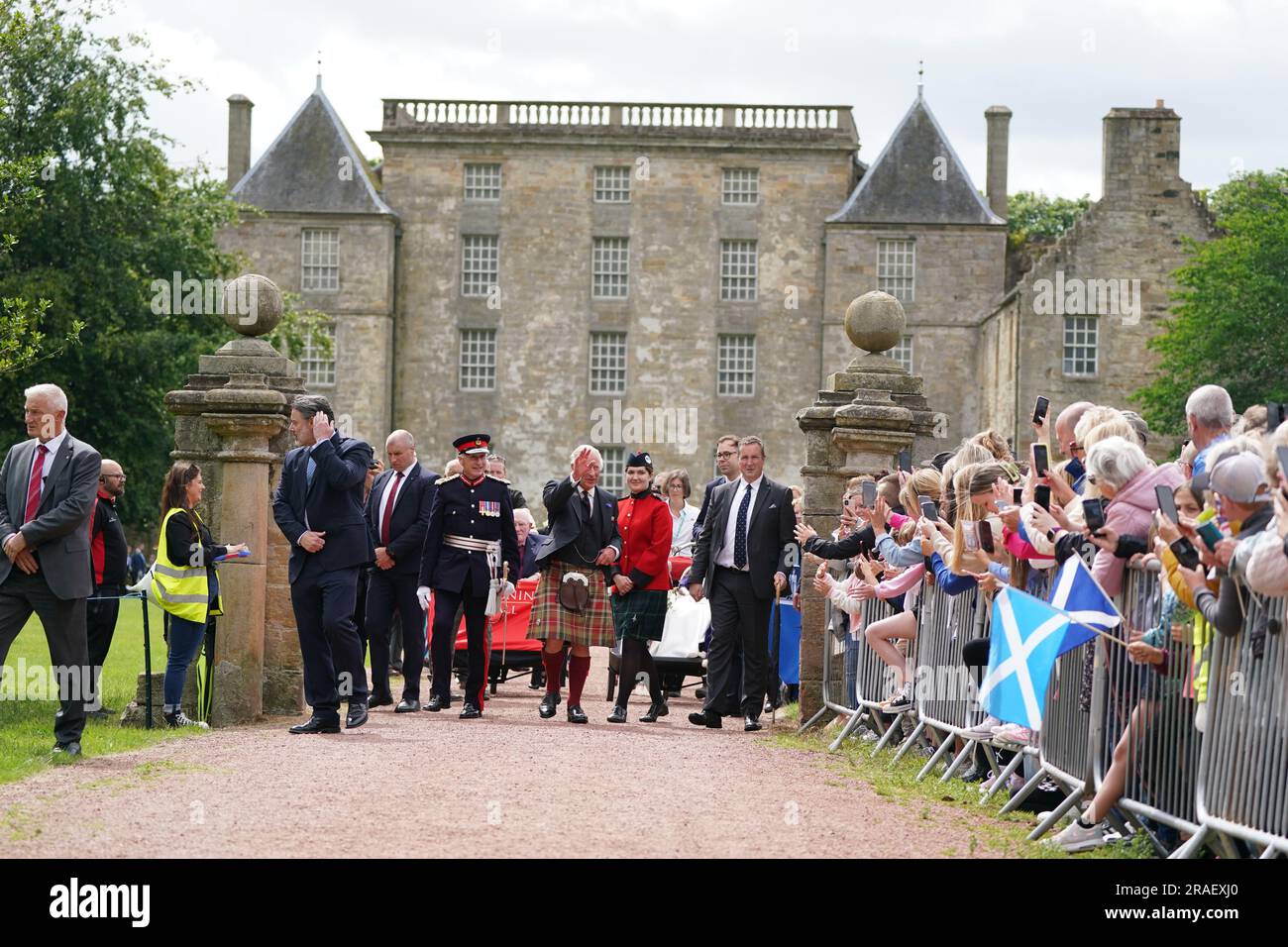 King Charles III (centre) during his visit to Kinneil House in ...