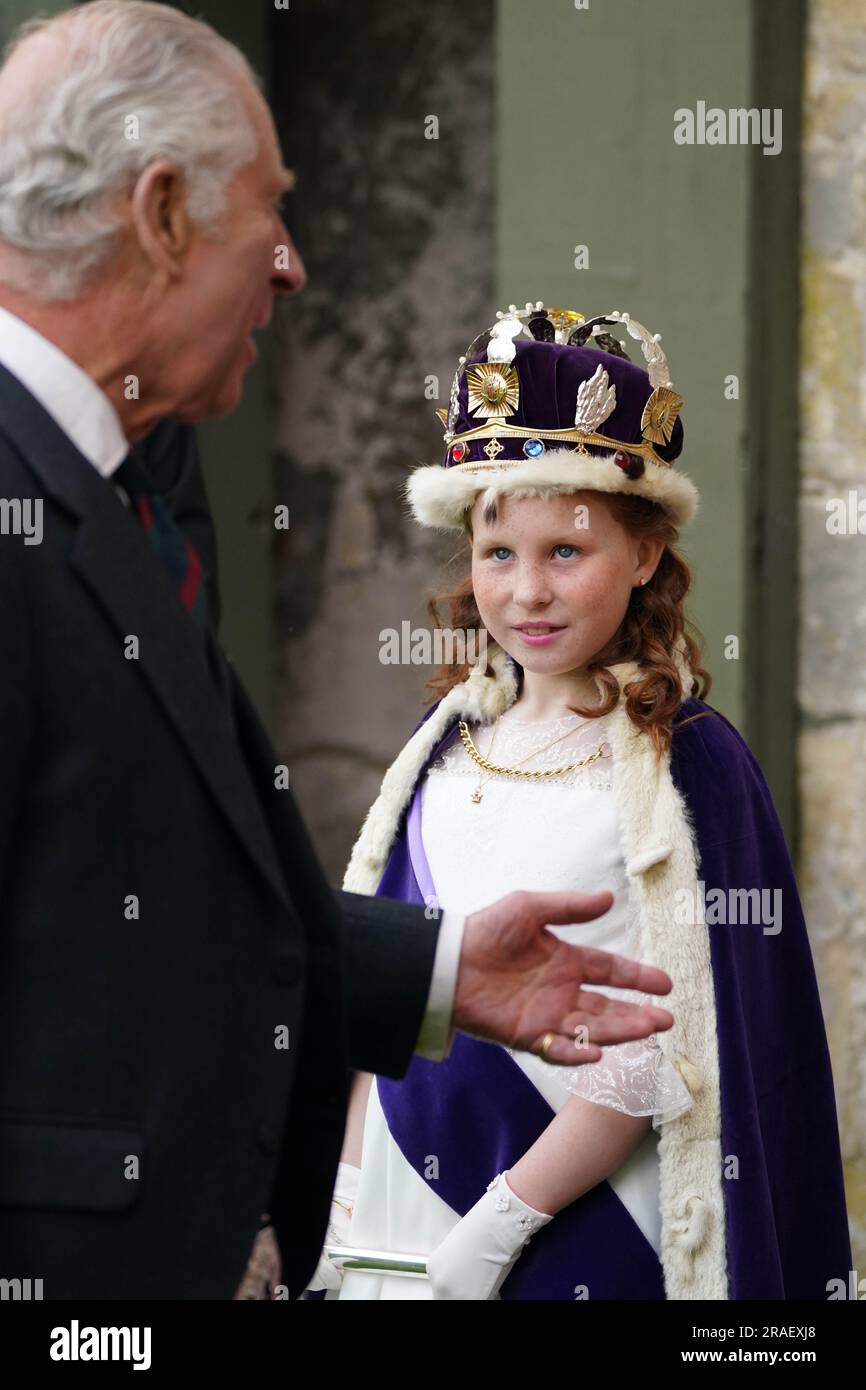 King Charles III greets the Bo'ness Fair Queen, Lexi Scotland, during ...
