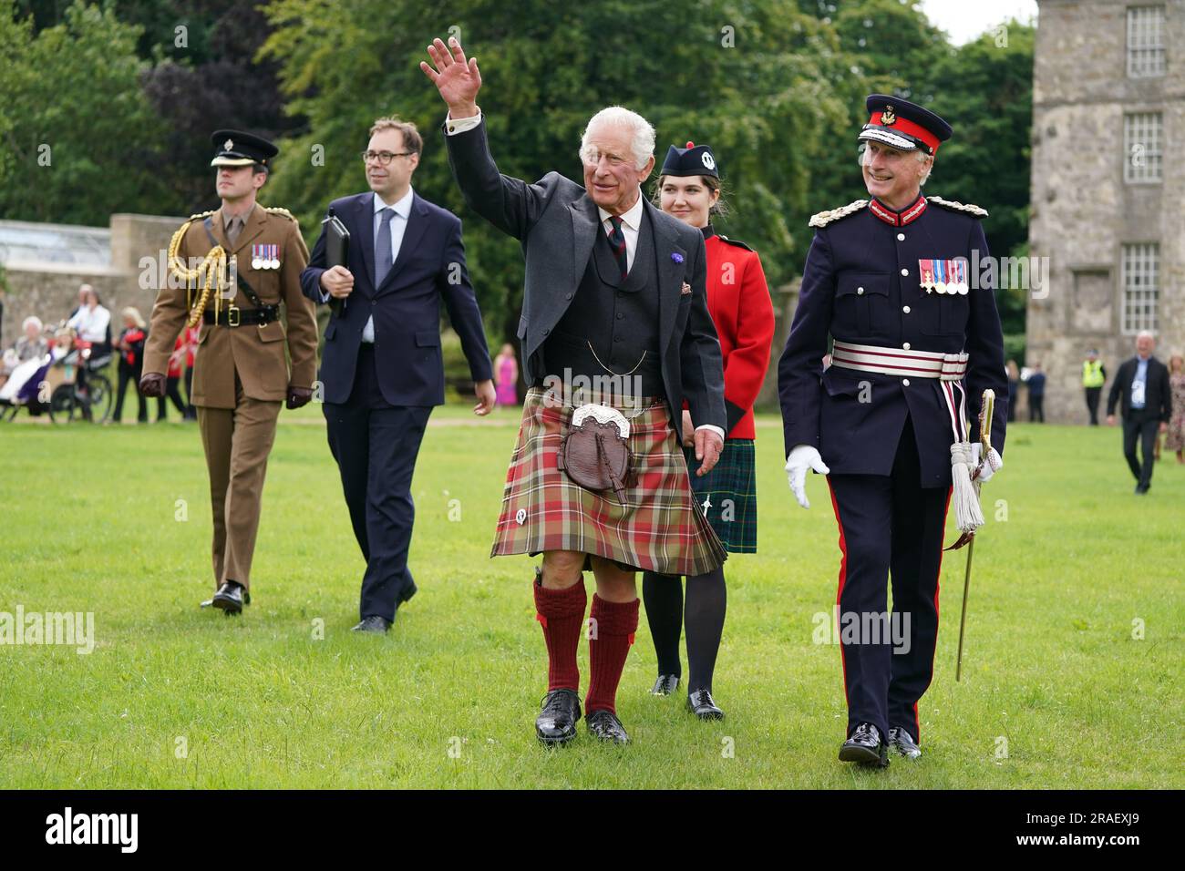 King Charles III (centre) during his visit to Kinneil House in ...