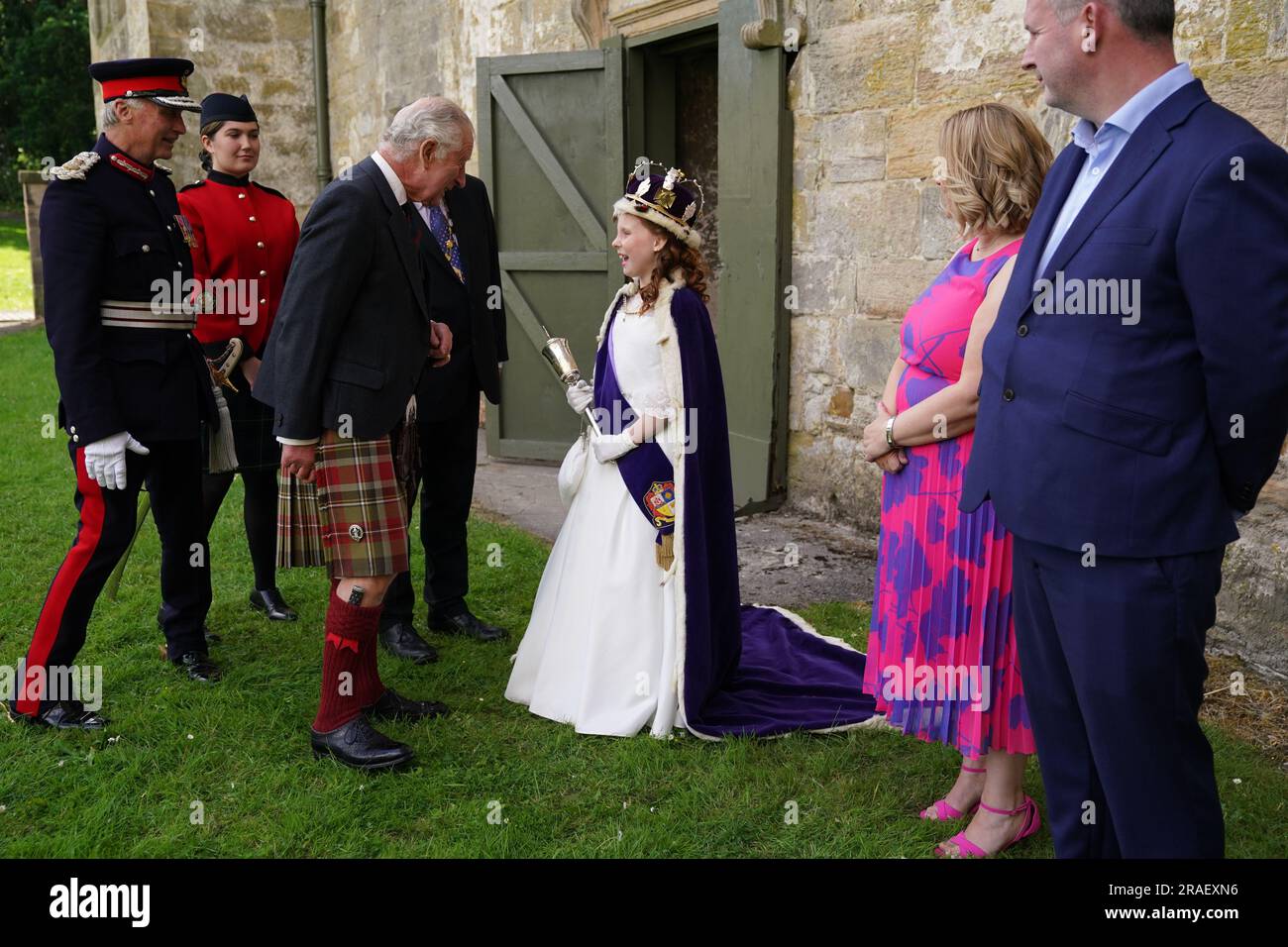 King Charles III greets the Bo'ness Fair Queen, Lexi Scotland, during ...