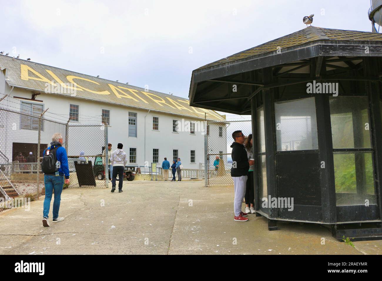 Tourists at the Quartermaster Warehouse with Alcatraz written on the ...
