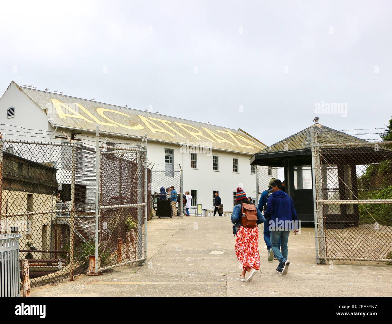 Tourists at the Quartermaster Warehouse with Alcatraz written on the ...