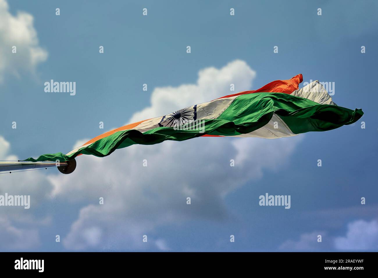 Indian National Flag flying high in blue sky Stock Photo - Alamy