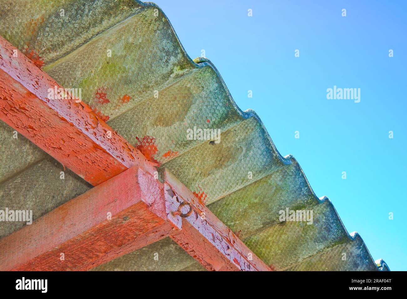 Old aged dangerous roof made of corrugated asbestos panels - one of the ...