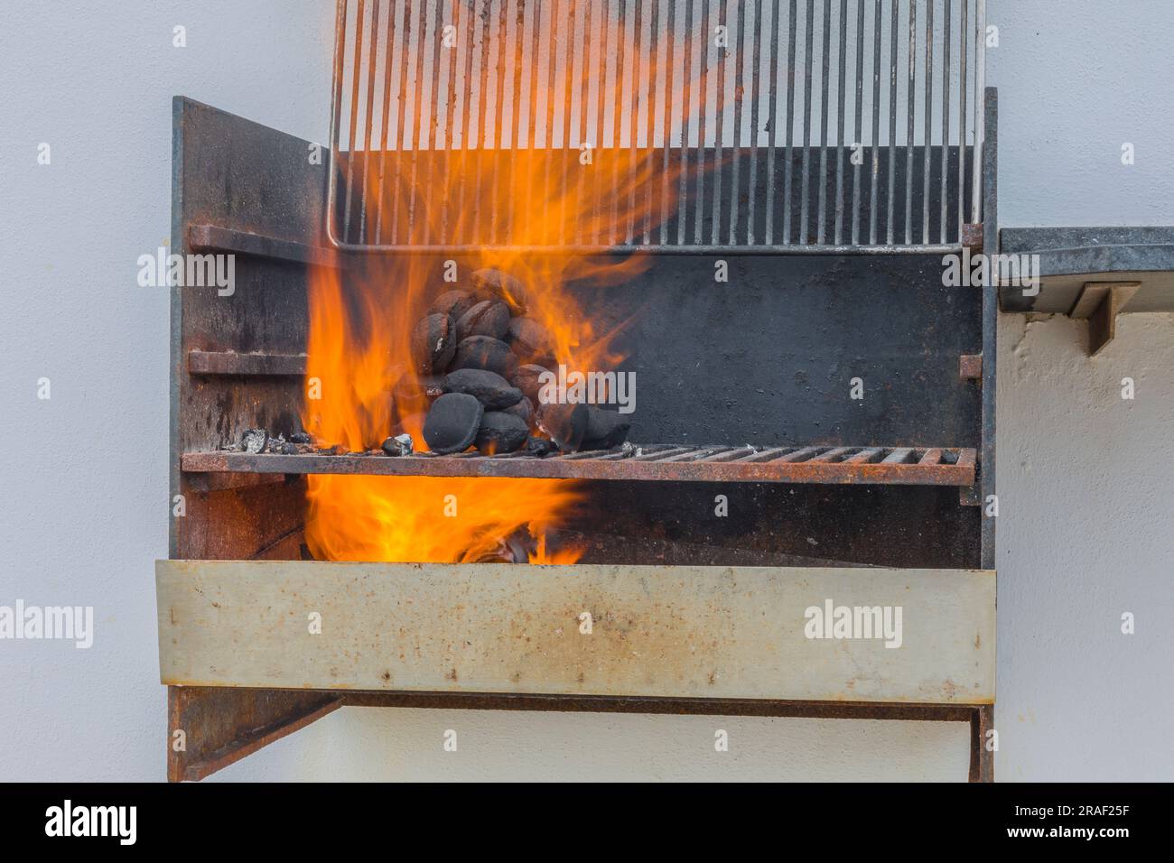 Open flame for preparing the grill Stock Photo - Alamy
