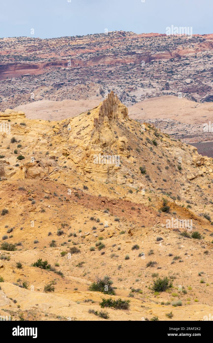 A sandstone rock formation with a thin fin resembling a stegasaurus ...