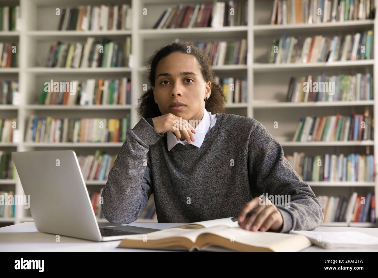 Serious handsome African college student posing for portrait Stock ...