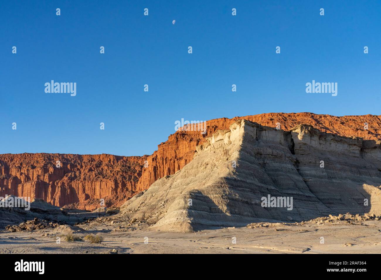 The moon over eroded geologic formations in Ischigualasto Provincial ...
