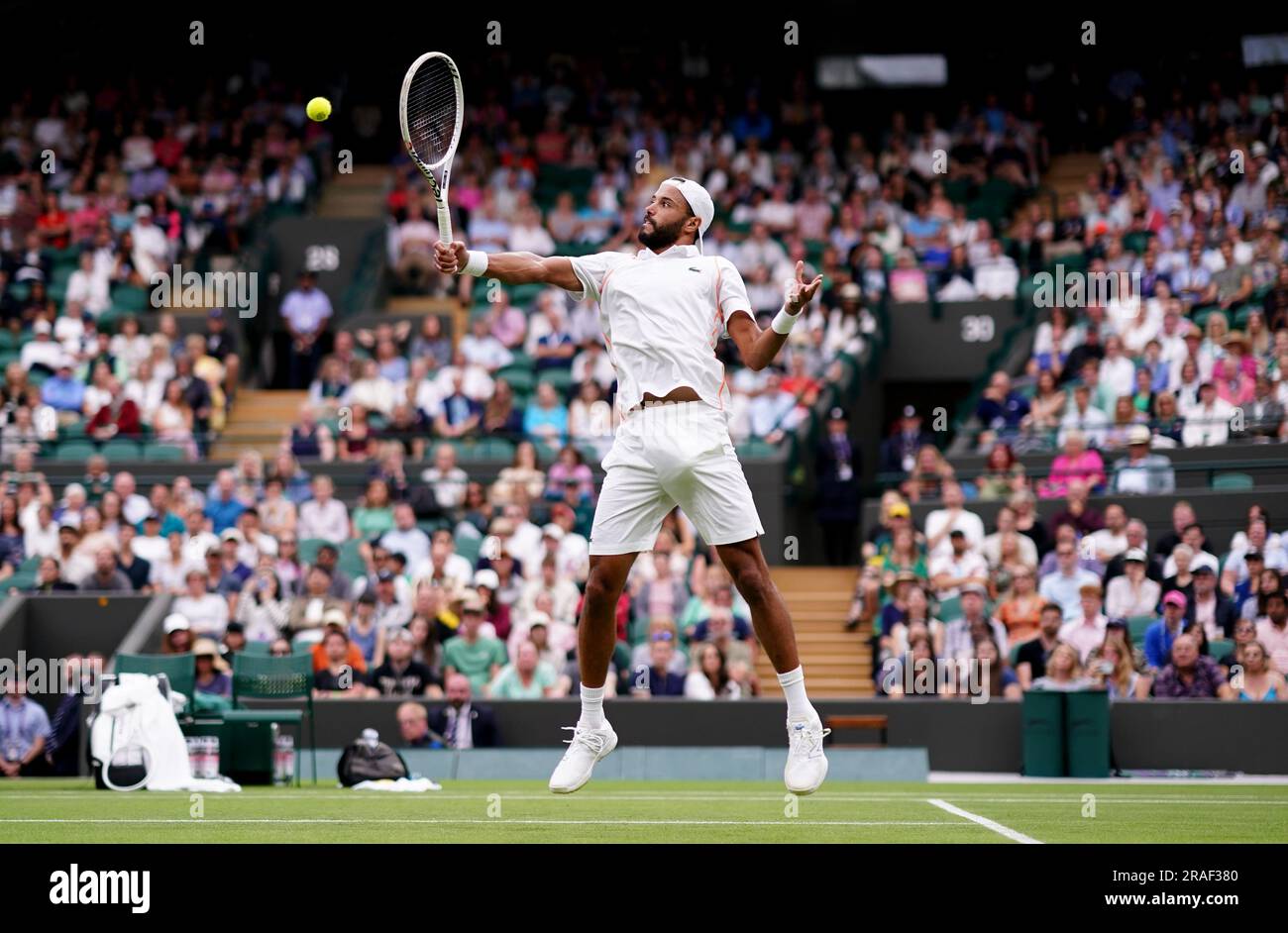 Laurent Lokoli in action against Casper Ruud (not pictured) on day one ...