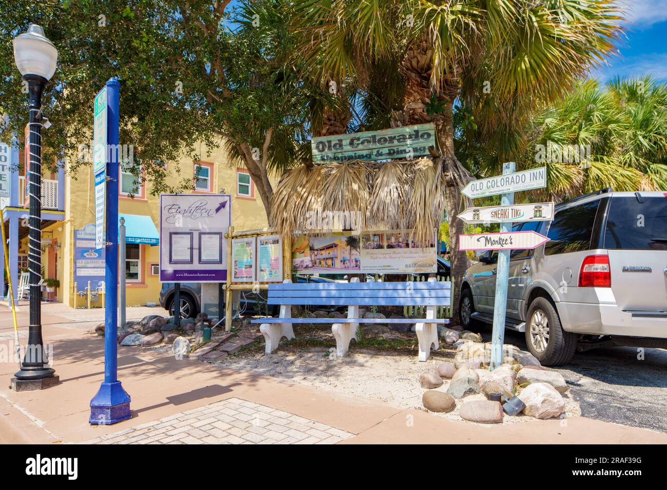 Stuart, FL, USA - July 1, 2023: Old bus bench with direction signs ...
