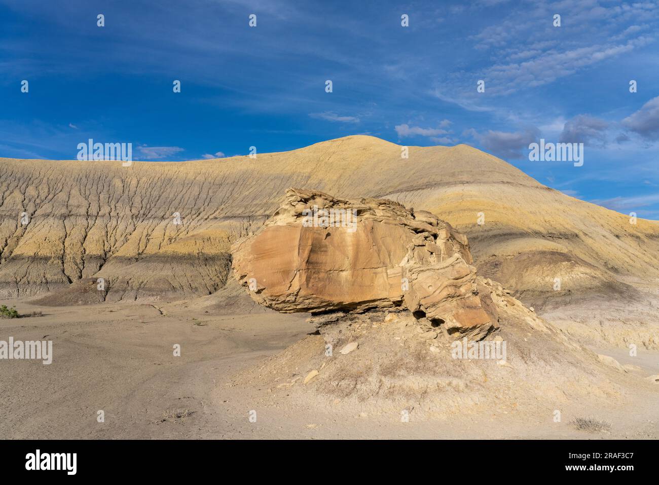 Colorful Mancos Shale formations with eroded sandstone boulders in the ...