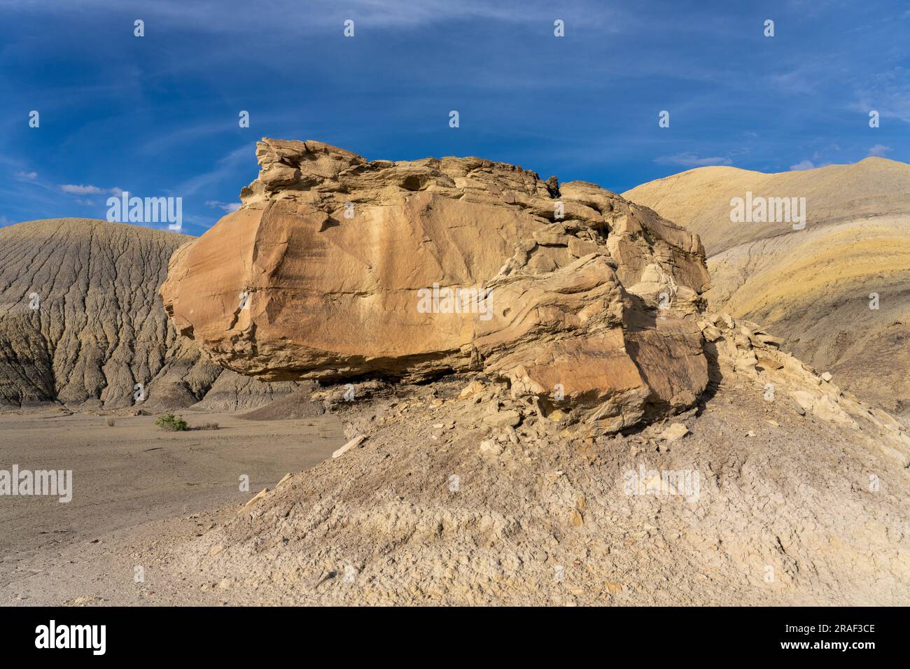 Colorful Mancos Shale formations with eroded sandstone boulders in the ...