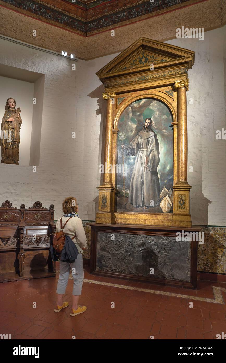 El Greco Museum, rear view of a female tourist studying the painting of ...