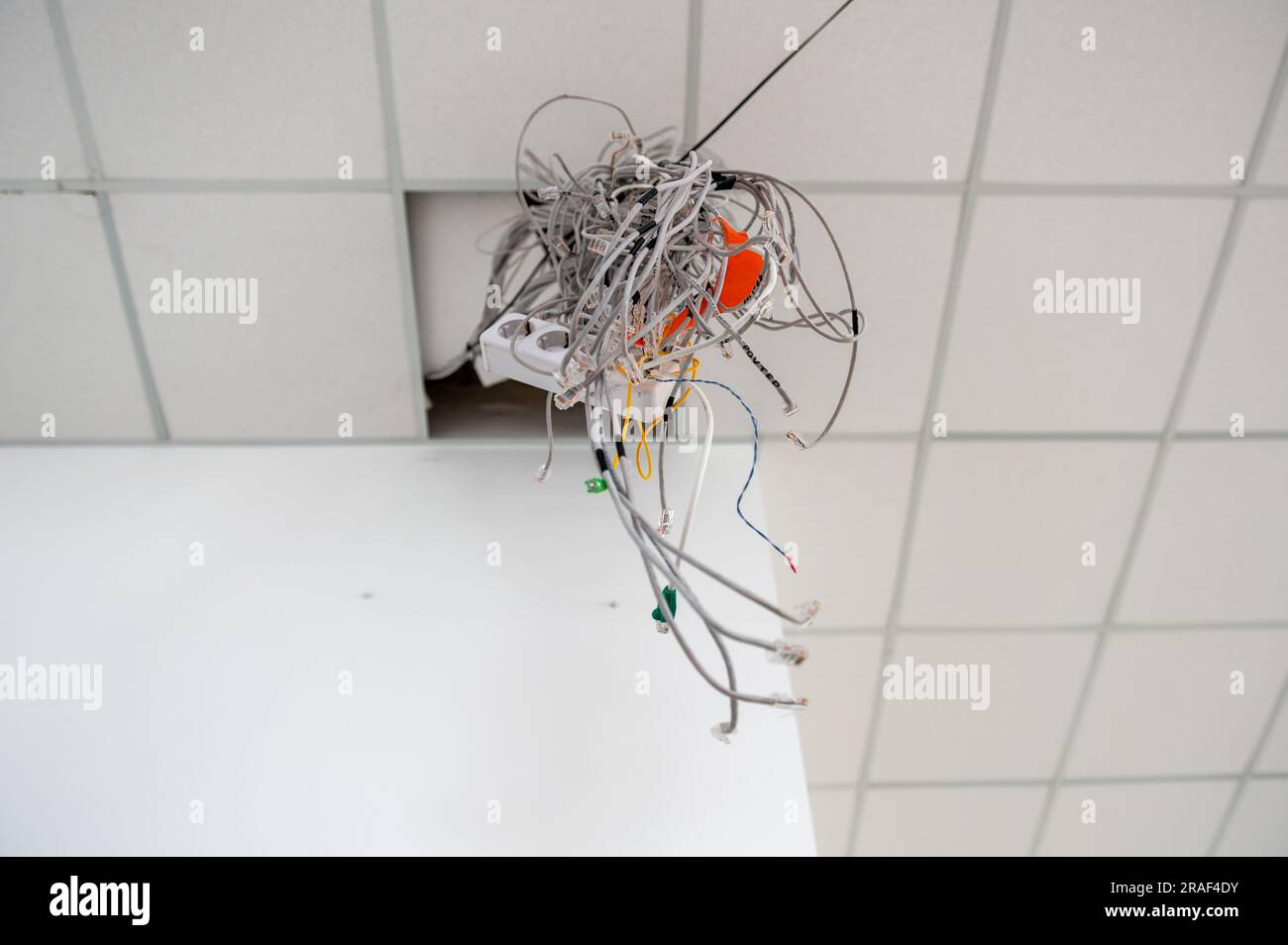 Electrical wires hanging from the ceiling. Cables hanging from ceiling ...