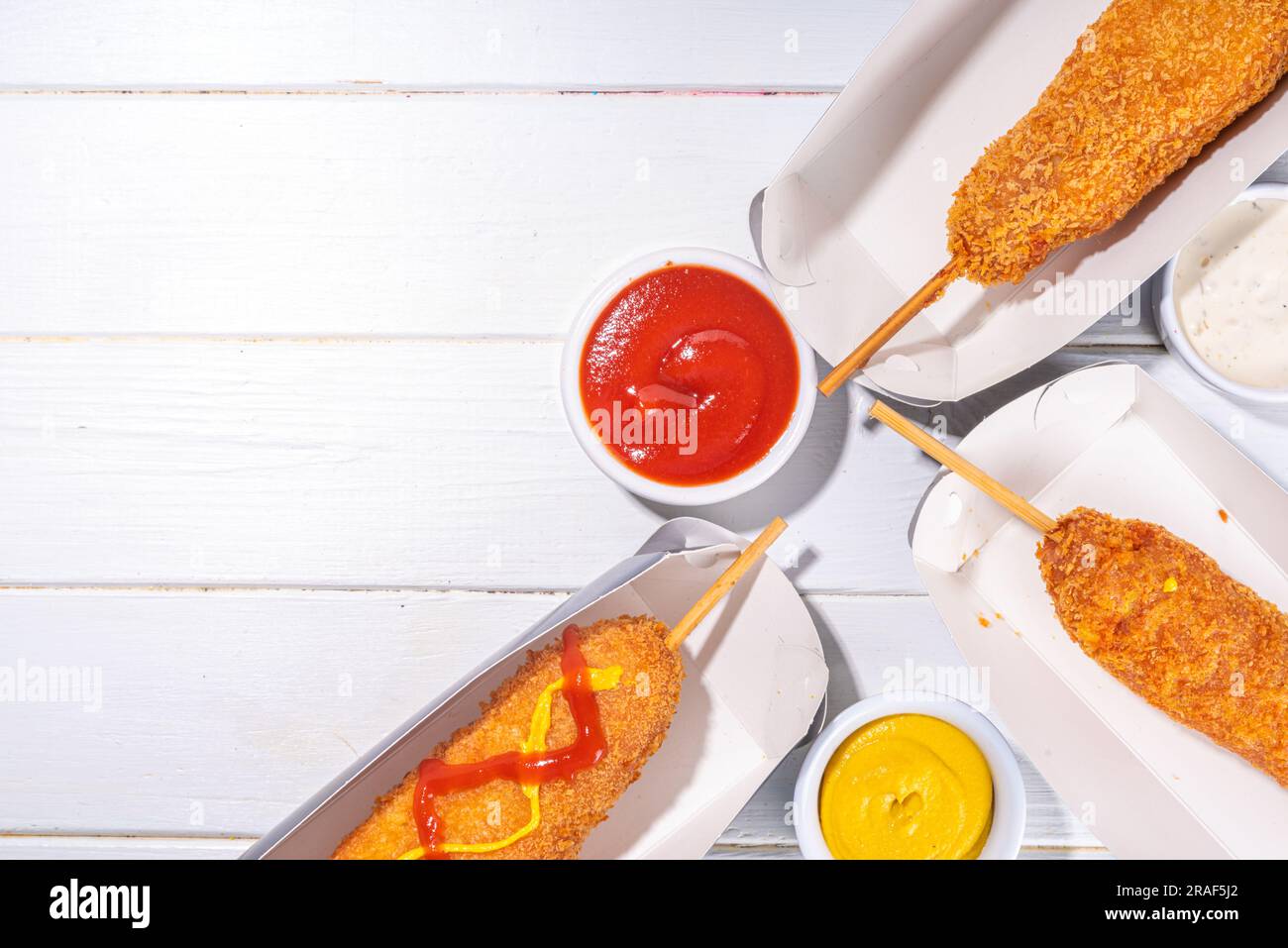 Traditional american, mexican corn dog with sauces - ketchup, mayo ...