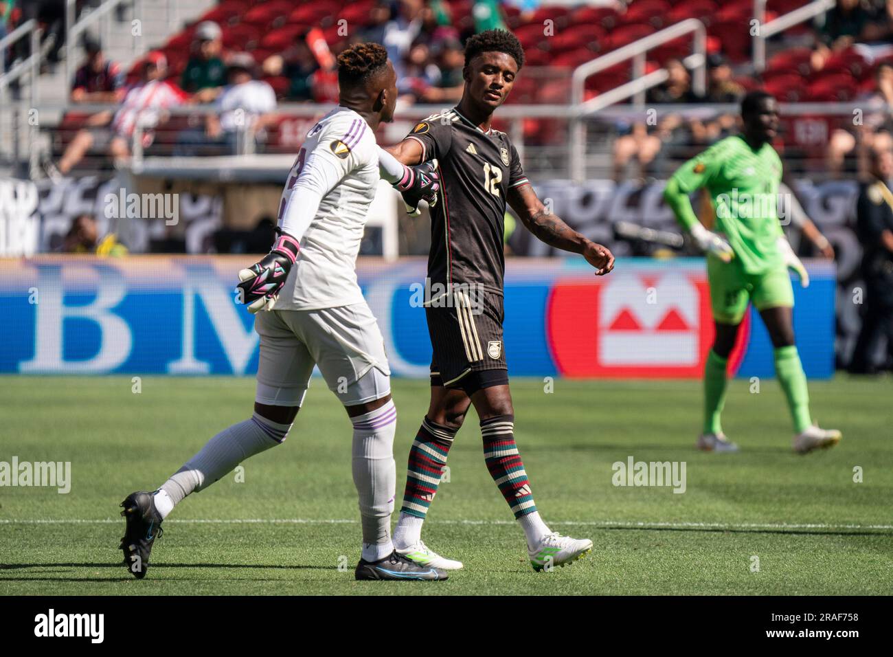 Jamaica forward Demarai Gray (12) and goalkeeper Jahmali Waite (23 ...