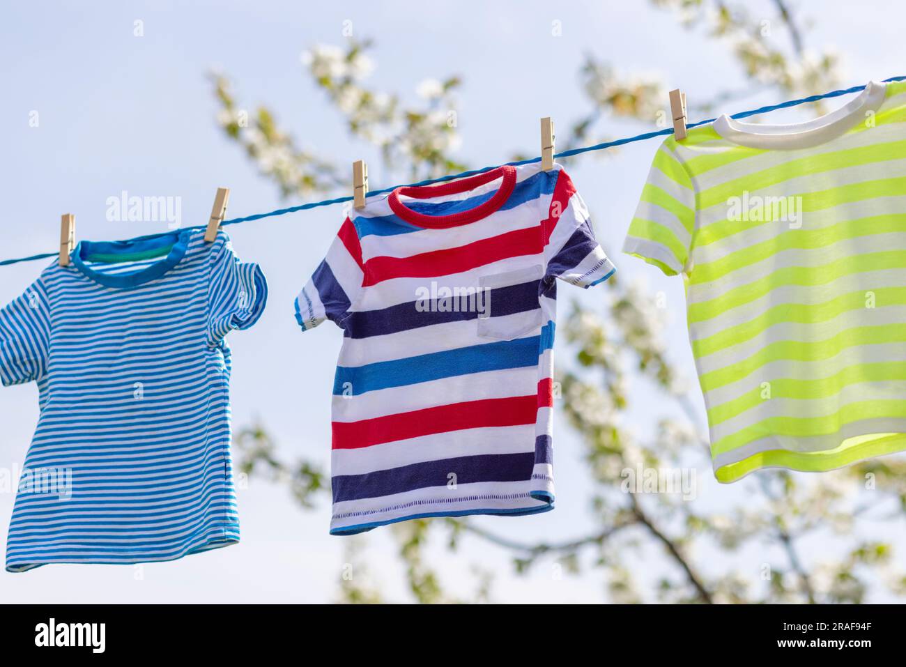 Clean clothes on rope outdoors on laundry day Stock Photo - Alamy