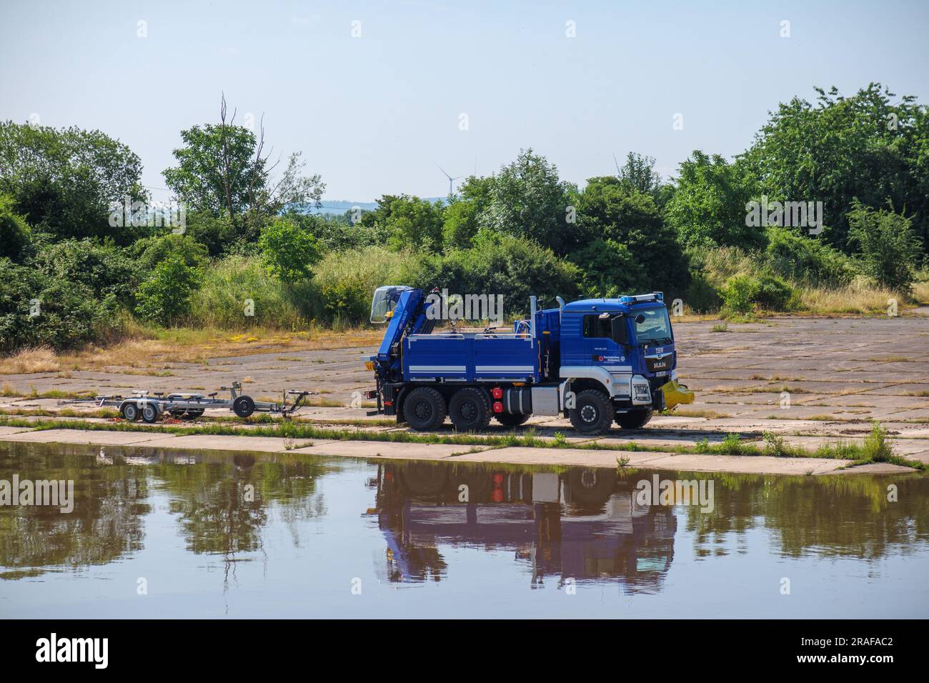 a vehicle of the german THW stands next to a river Stock Photo - Alamy