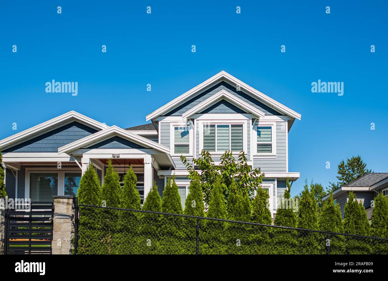 Real Estate Exterior Front House on a sunny day. Big custom made luxury ...