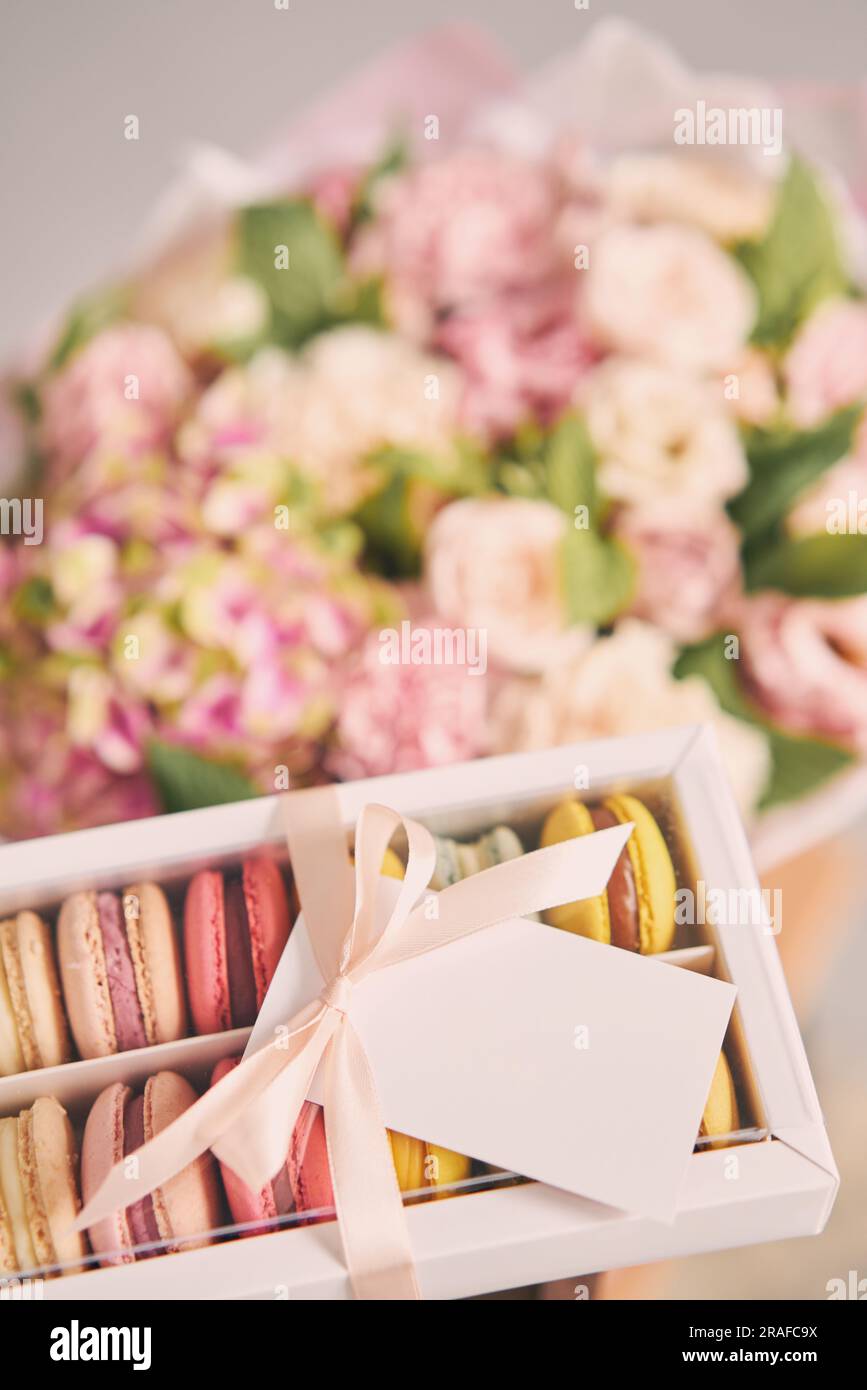 Dessert French Macarons in present box. Sweet dessert on a flowers ...