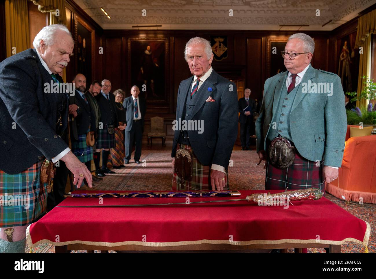 King Charles III with designer Mark Dennis (left), Lord Lyon (right ...