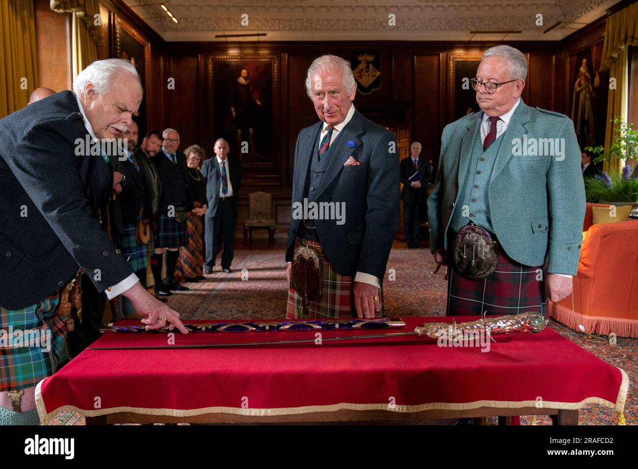 King Charles III with designer Mark Dennis (left), Lord Lyon (right ...