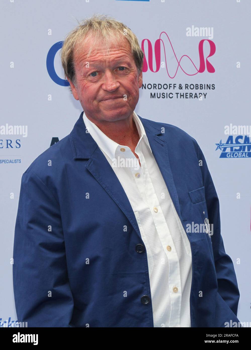 London.UK. Mark King at the Nordoff and Robbins O2 Silver Clef Awards ...