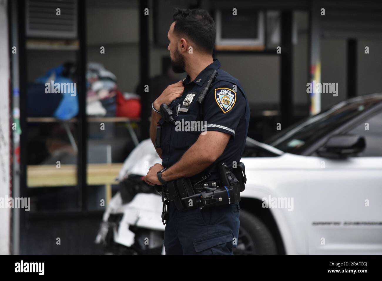 Police officer guards the crime scene. Two people were killed and four ...