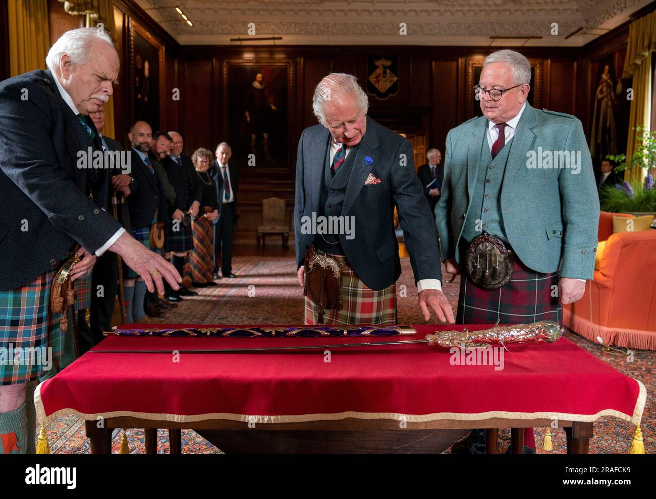King Charles III with designer Mark Dennis (left), Lord Lyon (right ...