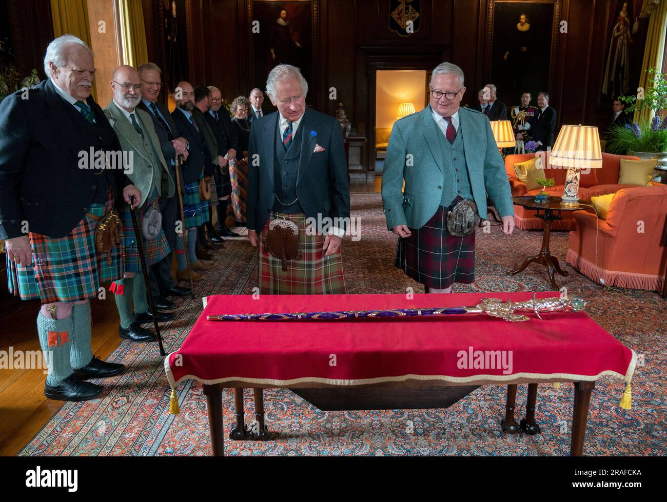 King Charles III with designer Mark Dennis (left), Lord Lyon (right ...