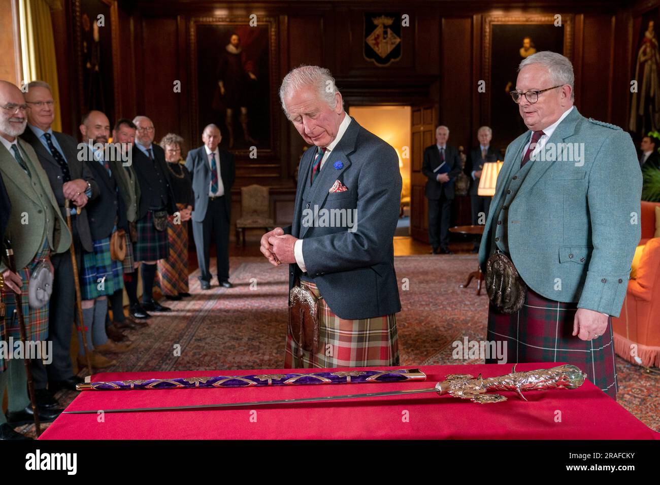 King Charles III with the Lord Lyon (right) and the new Elizabeth Sword ...