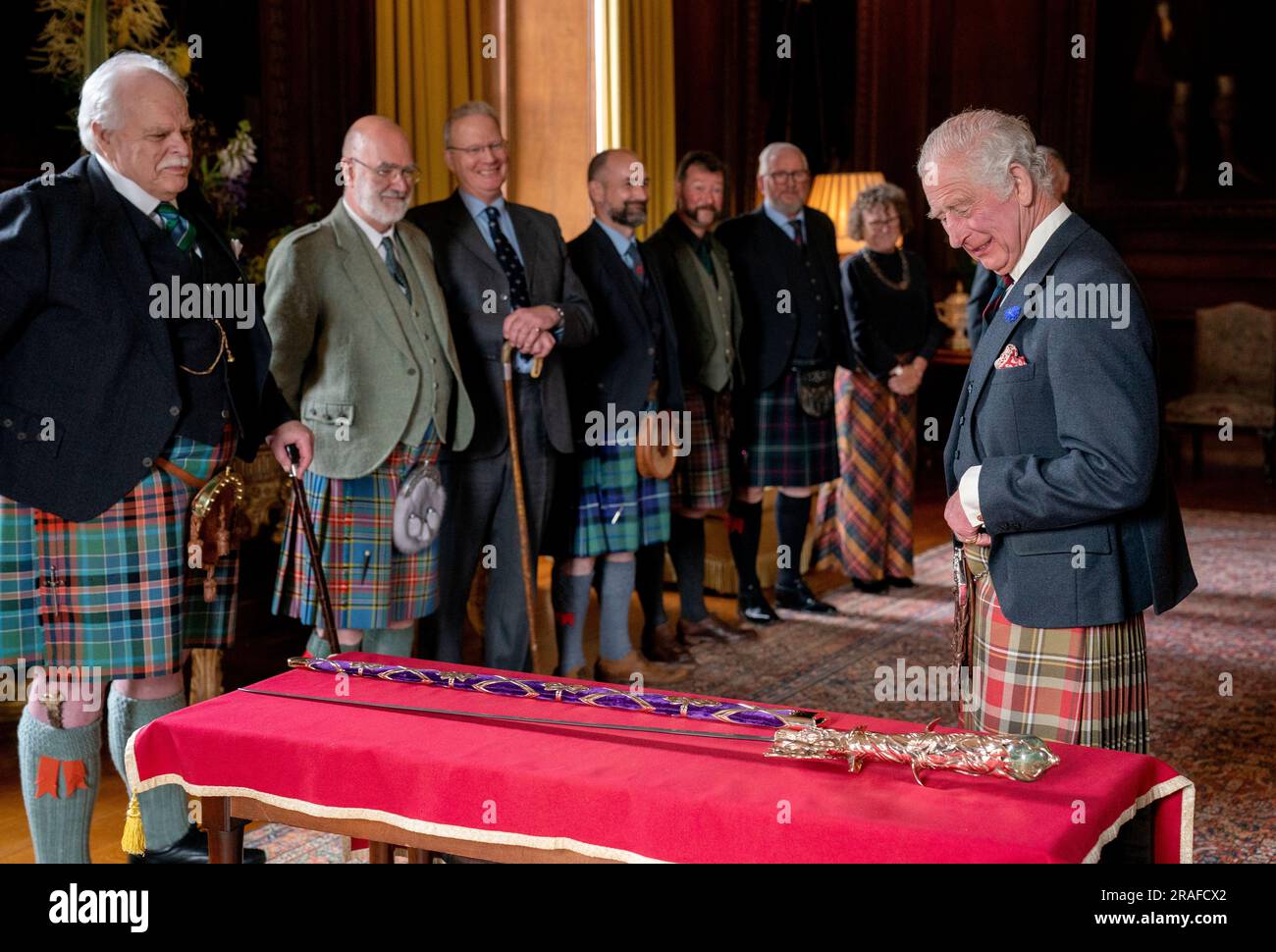 King Charles III with designer Mark Dennis (left) and the new Elizabeth ...