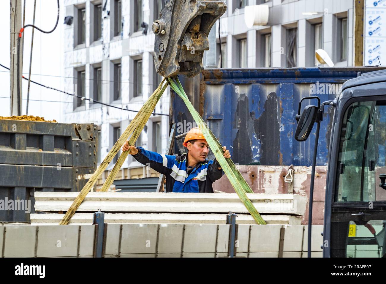 Russia, Moscow. Construction of residential buildings. The worker takes ...
