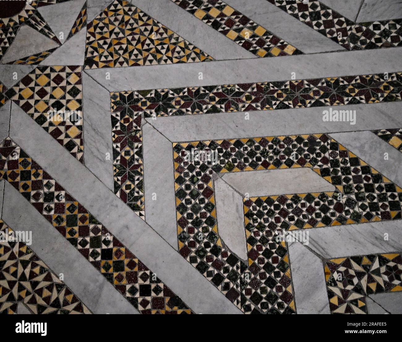 Medieval Cosmatesque mosaic floor in the interior of the Baroque style ...