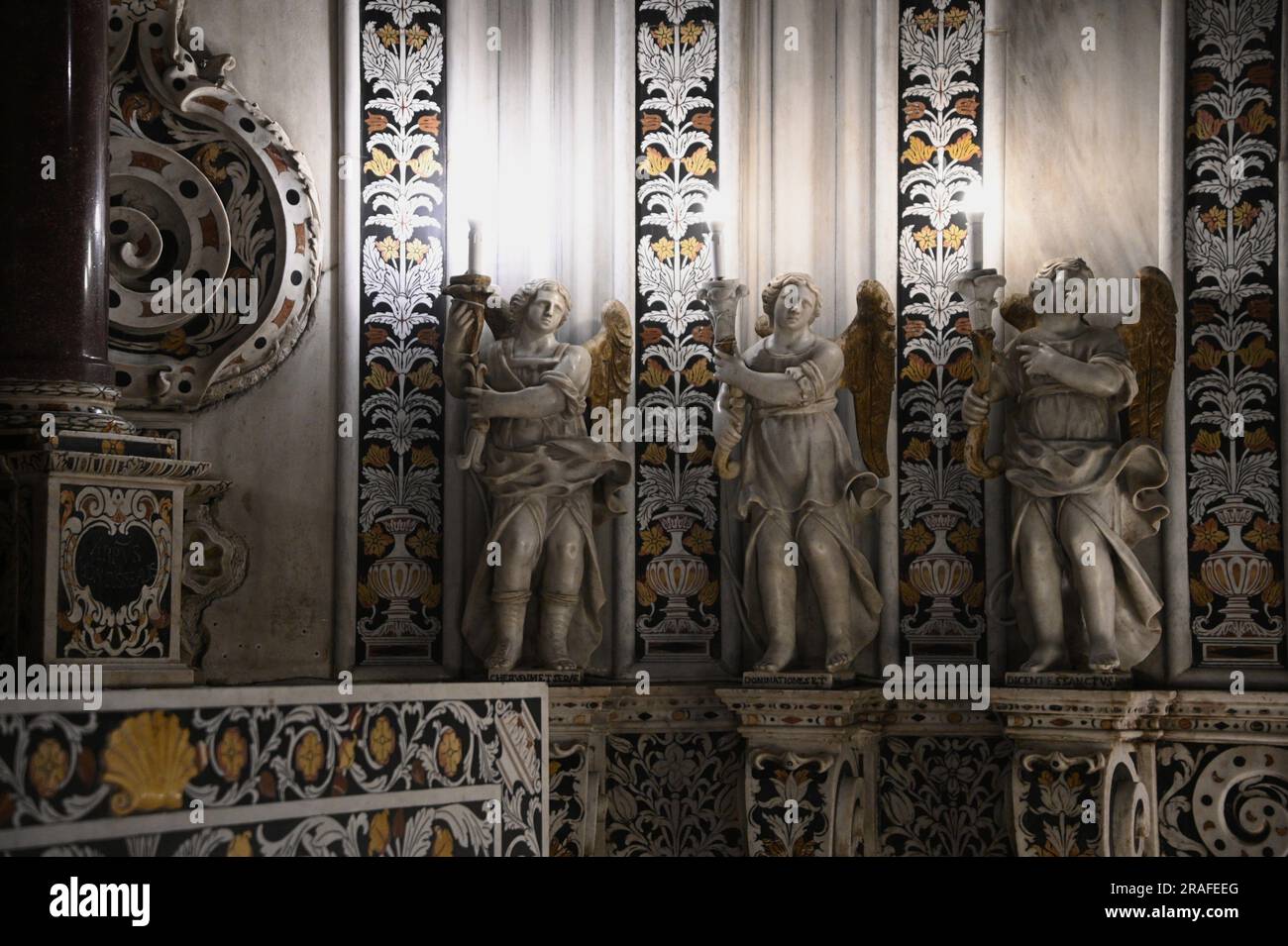 Marble sculpted angels in the interior of the Baroque style Cappella ...
