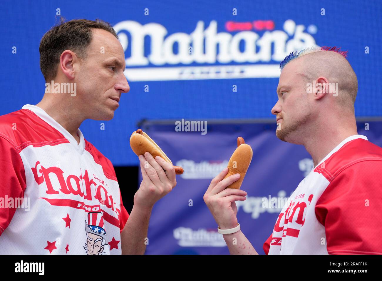 Competitive eaters Joey Chestnut, left, and Nick Wehry, right, face off ...