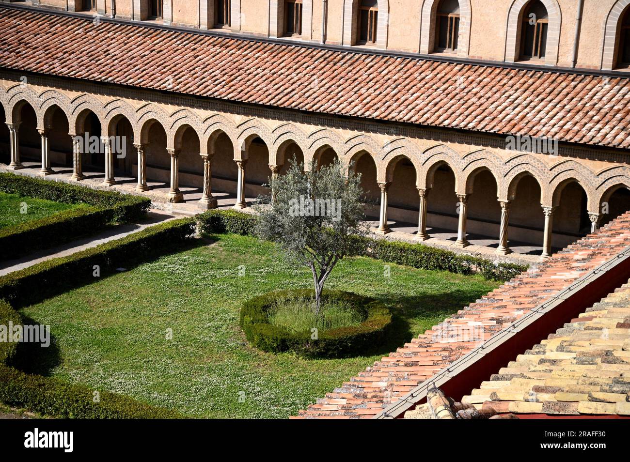 Glimpse of the right gallery of the Sicilian Benedictine cloister a ...