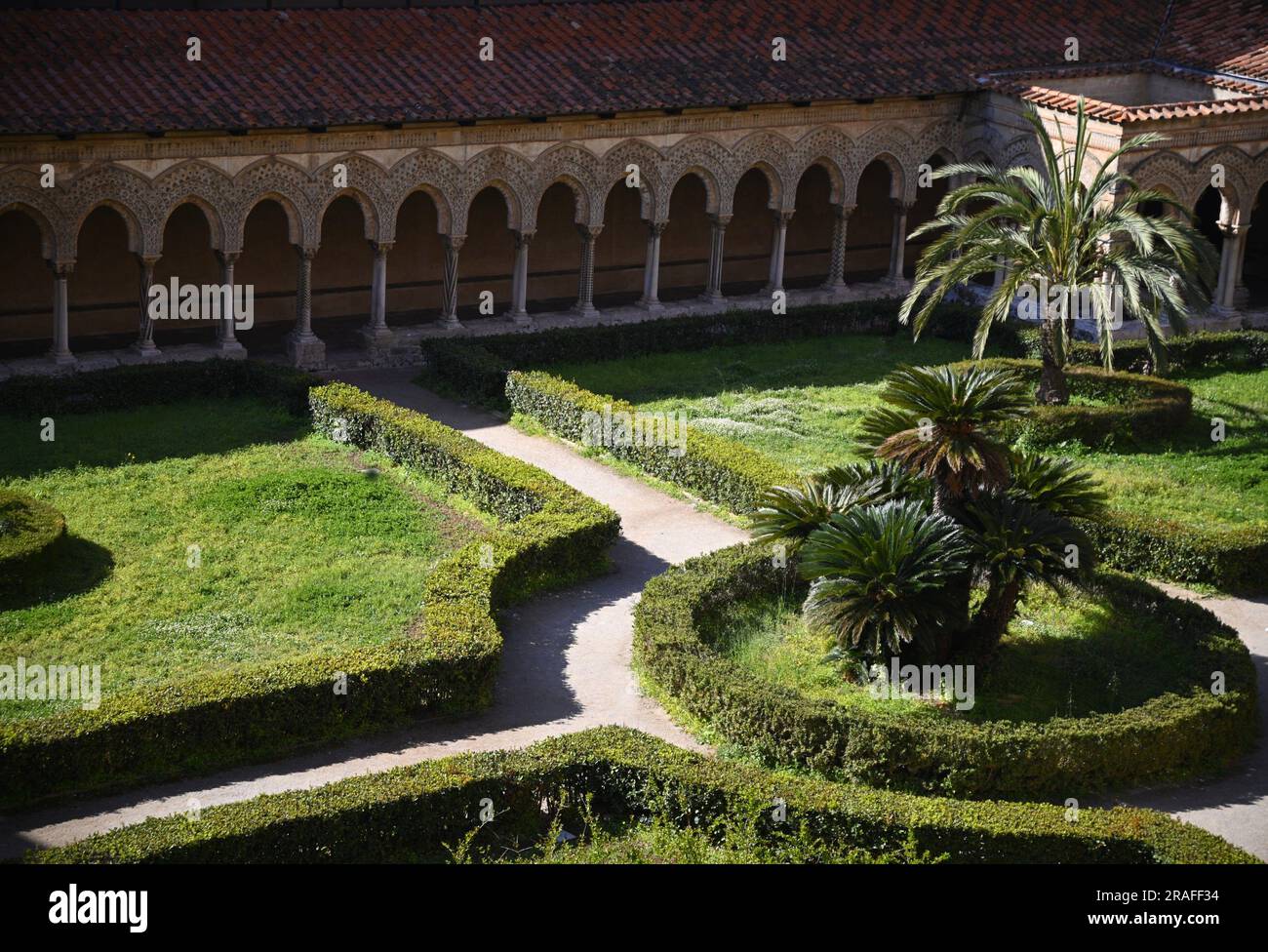 Glimpse of the right gallery of the Sicilian Benedictine cloister a ...