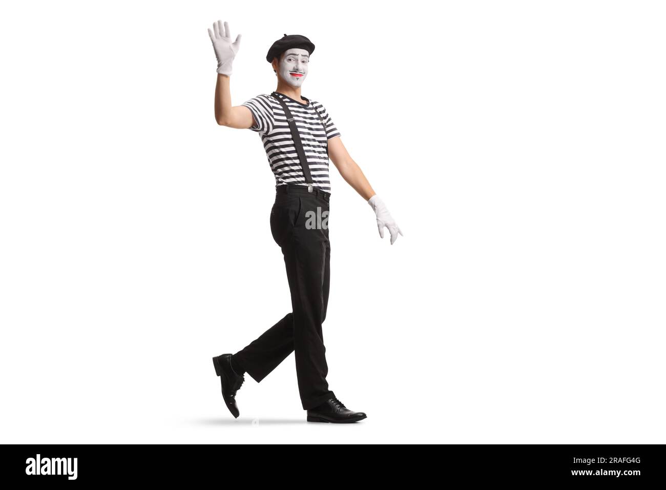 Full length shot of a mime walking and waving isolated on white ...