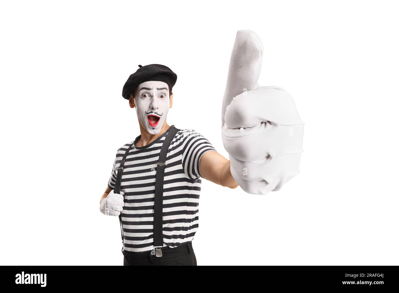 Cheerful mime gesturing a thumb up sign isolated on white background ...