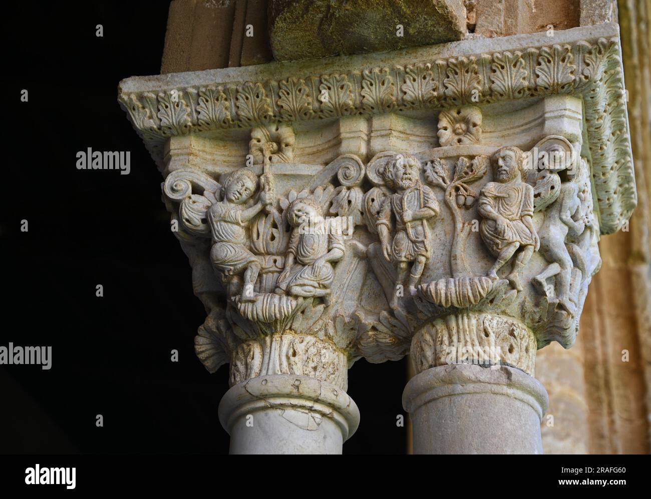 Antique Romanesque style column capital depicting scenes from the Old ...