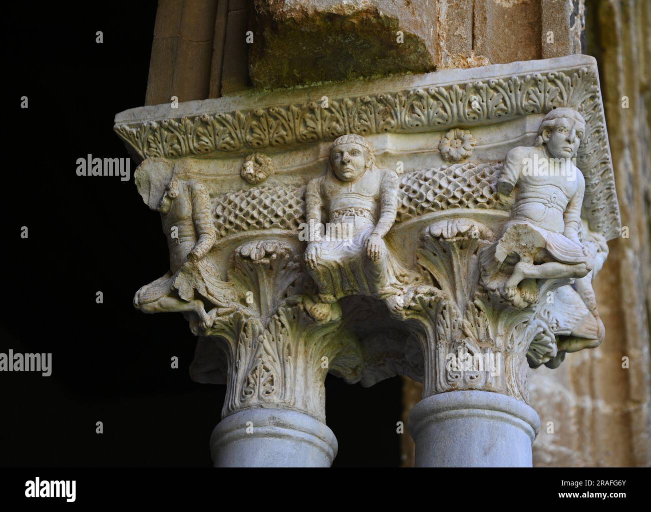 Antique Romanesque style column capital depicting scenes from the Old ...
