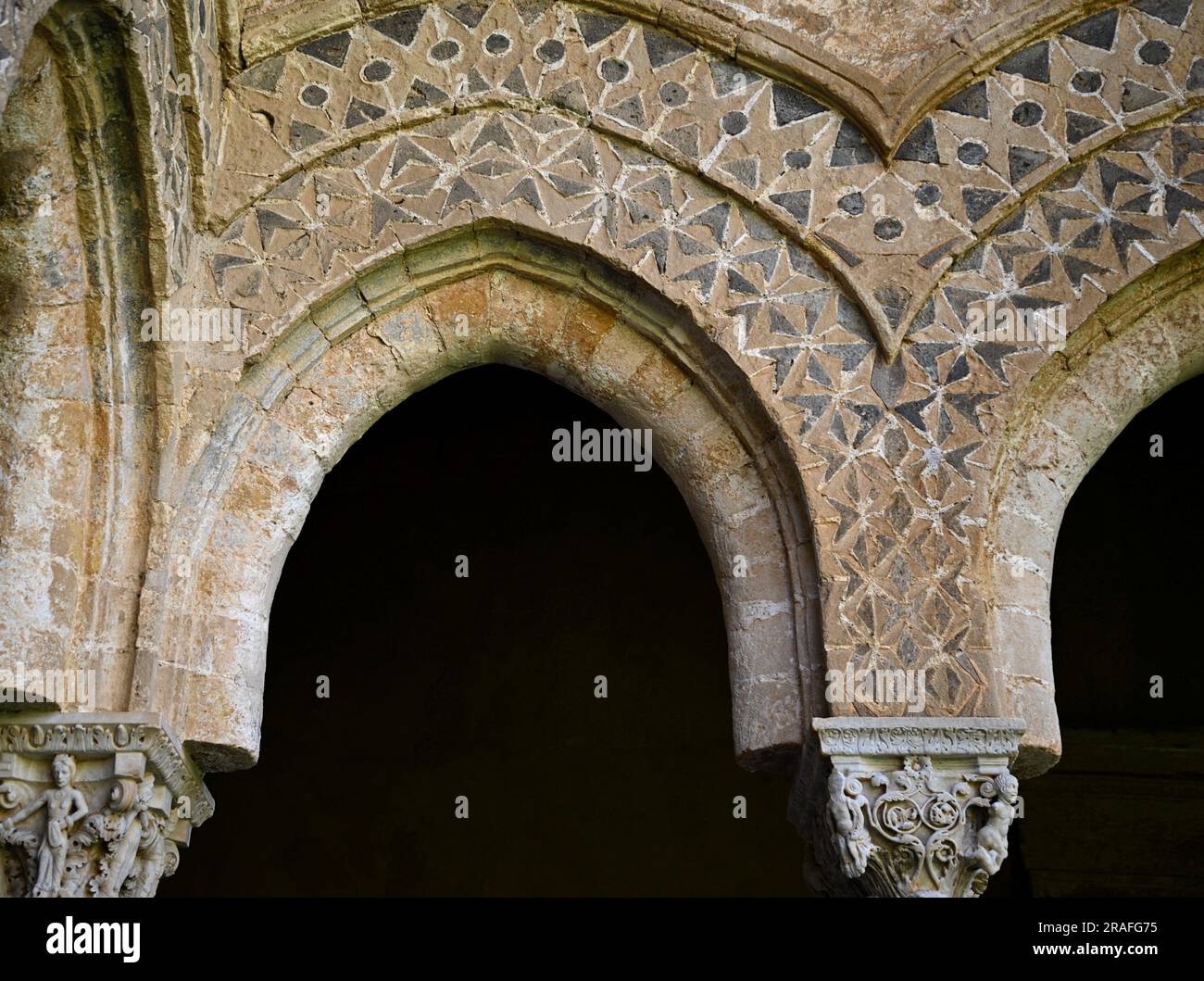 Arabesque Norman style arches and columns with Romanesque style carved ...
