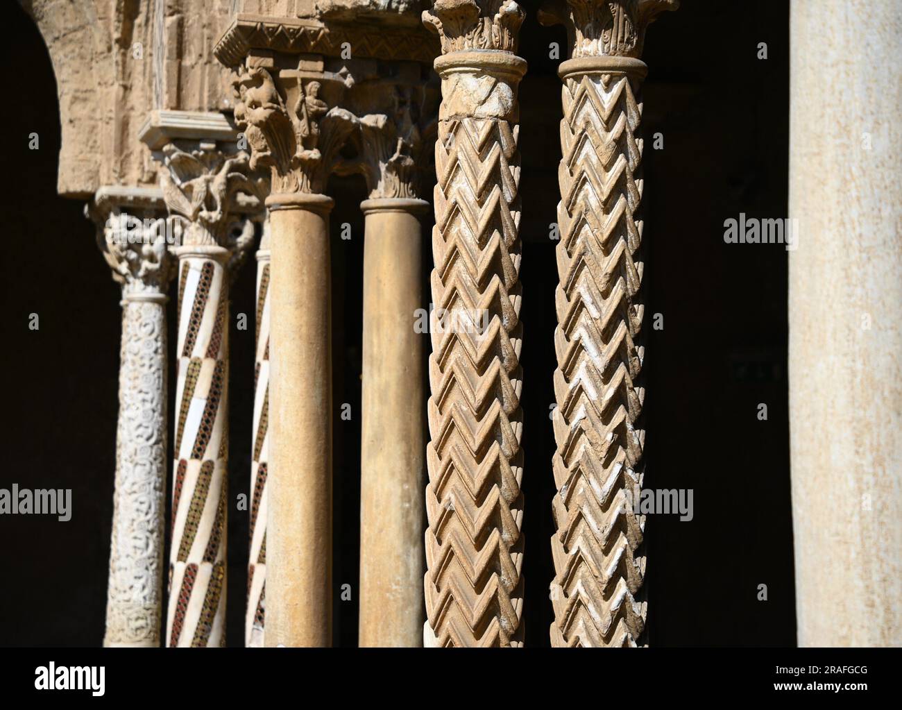 Arab Norman style arches and columns with Romanesque style carved ...