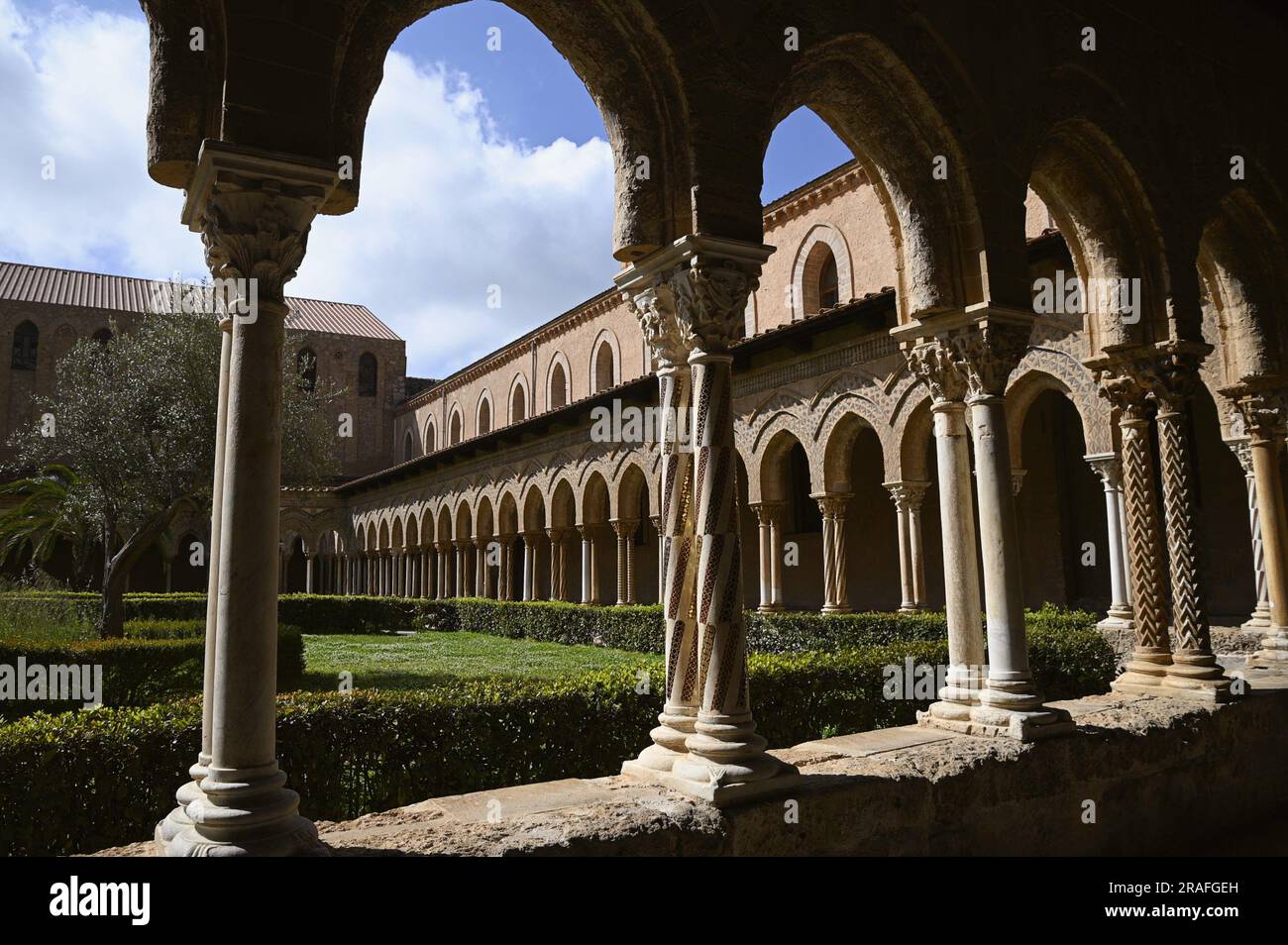Glimpse of the right gallery of the Sicilian Benedictine cloister a ...