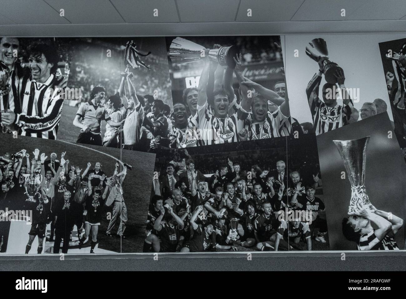 A wall with the pictures of some trophies won by Juventus Football Club ...