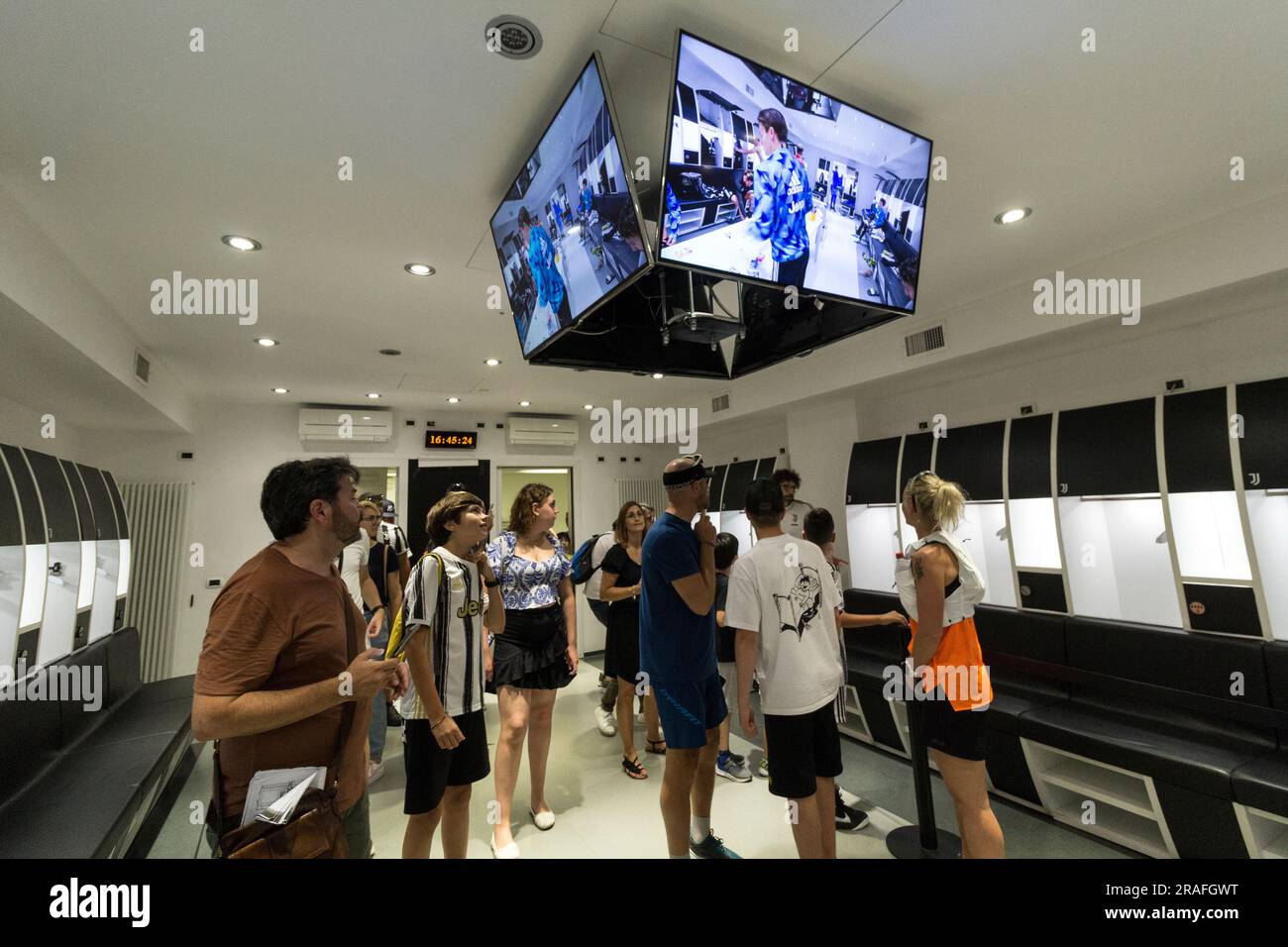 Supporters inside the Juventus dressing room during a tour of the ...
