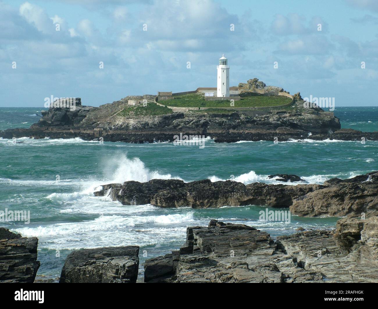Autumn sunlight illuminates the white 26-metre octagonal tower of ...